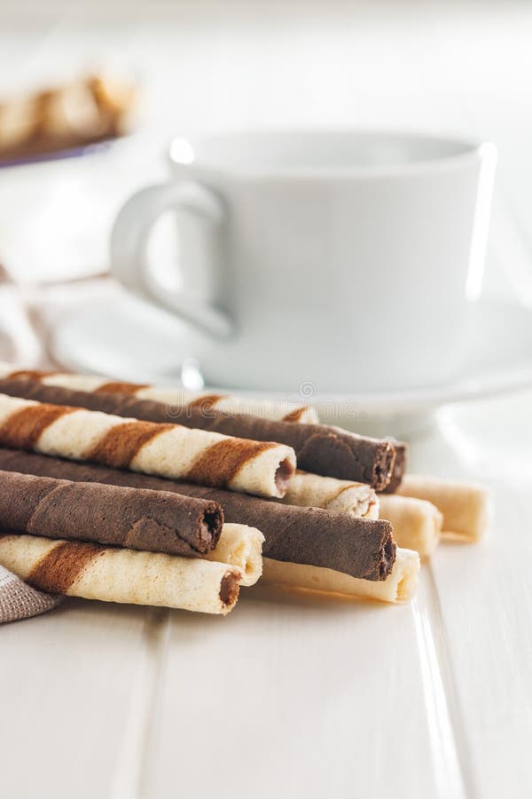 Assorted Chocolate and Vanilla Cream Filled Wafer Rolls on White Table ...