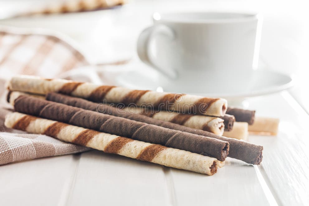 Assorted Chocolate and Vanilla Cream Filled Wafer Rolls on White Table ...