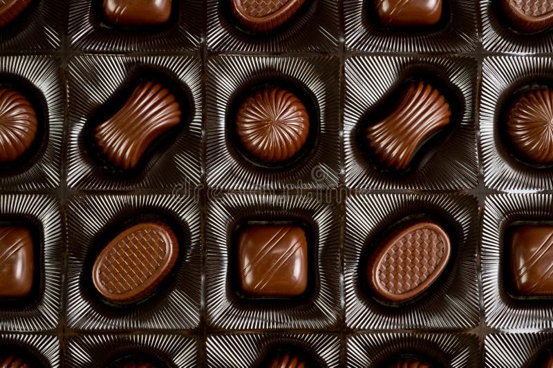 Assorted Chocolates Lying in a Box. Background for Products from ...