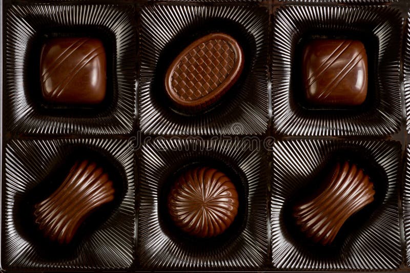 Assorted Chocolates Lying in a Box. Background for Products from ...