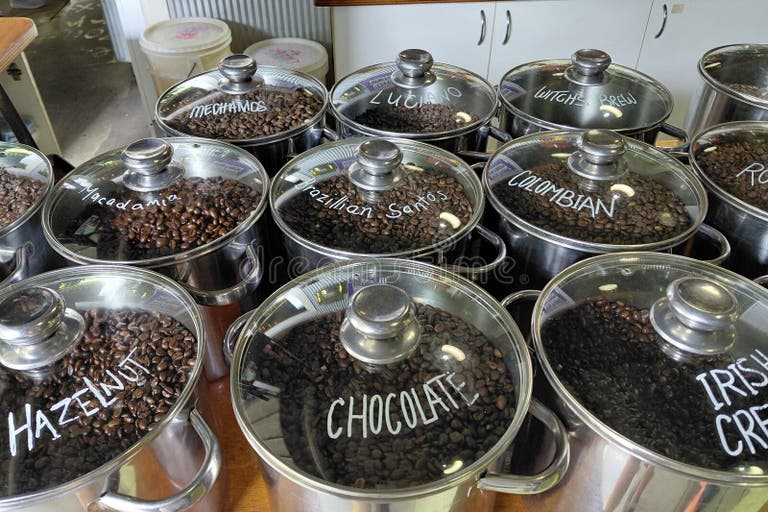 Assorted Coffee Beans in Labeled Metallic Containers Stock Photo ...