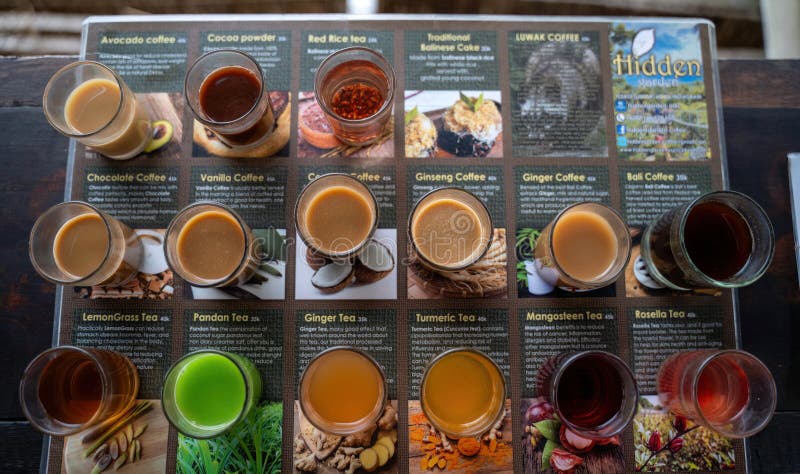 Assorted Coffee and Tea Samples on a Wooden Tabletop with Descriptive ...