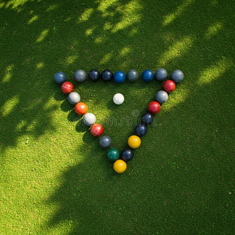 Assorted Colored Balls Neatly Arranged in a Triangular Formation on a ...