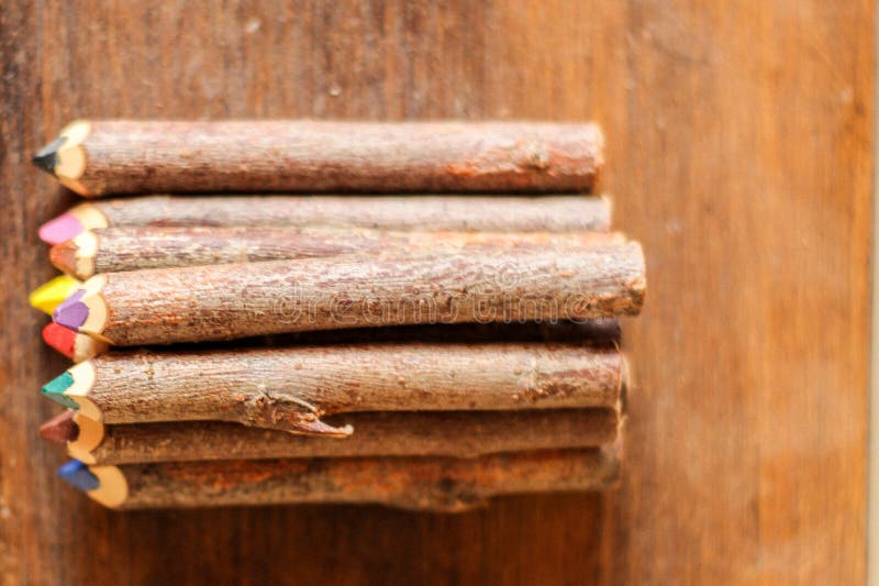 Several Colored Pencils on a Wooden Table Top Together, Arranged into a ...