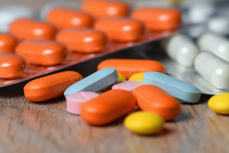 Assorted Colored Tablets and Tablet Packaging Close-up on the Table ...