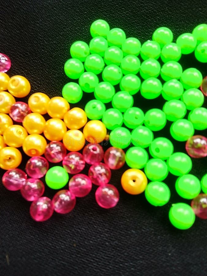 Assorted Colorful Beads on Textured Black Surface for Craft Projects ...