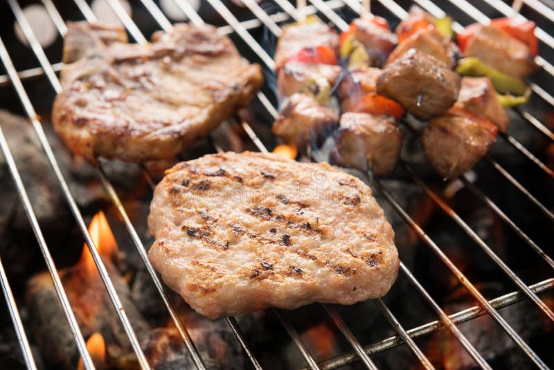 Assorted Delicious Grilled Meat Over the Coals on a Barbecue Stock ...