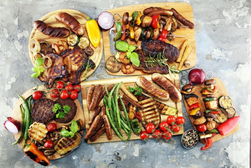 Assorted Delicious Grilled Meat with Vegetable on Rustic Table Stock ...