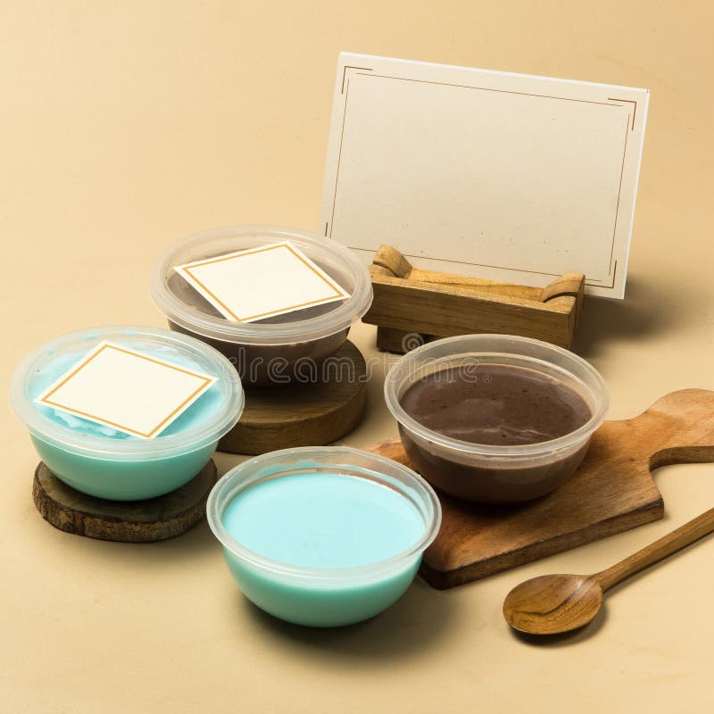 Assorted Dessert Cups Filled with Blue and Chocolate Pudding Presented ...