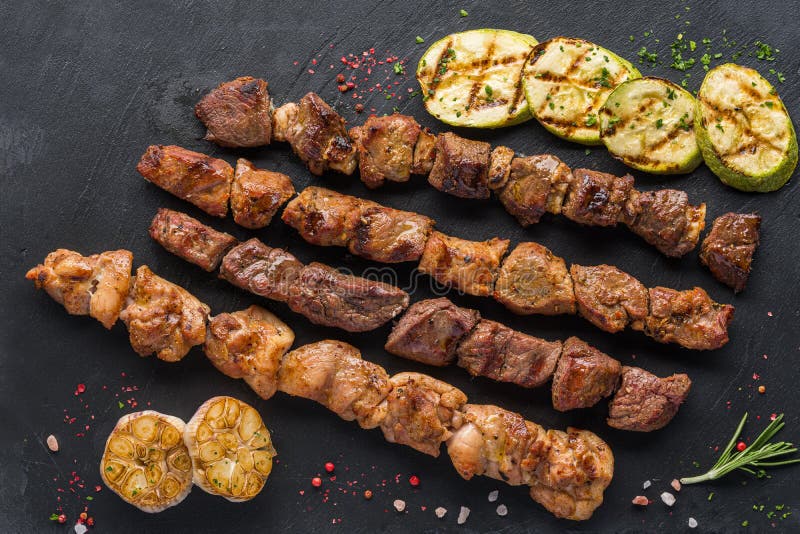Assorted Different Kebabs on a Black Stone Plate Stock Photo - Image of ...