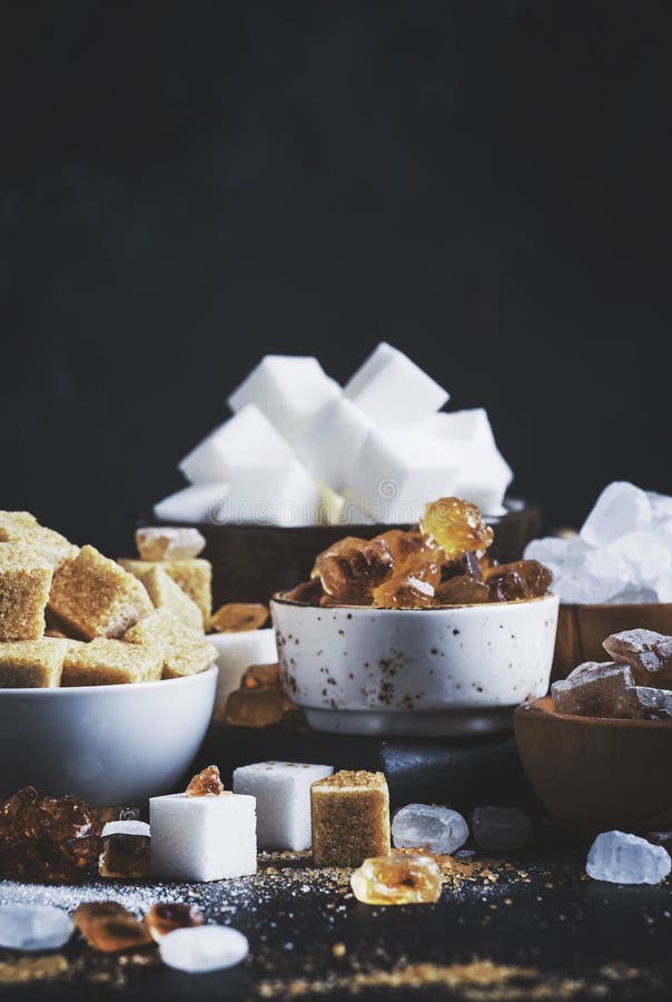 Assorted Different Types of Sugar in Bowls on a Table on a Dark ...