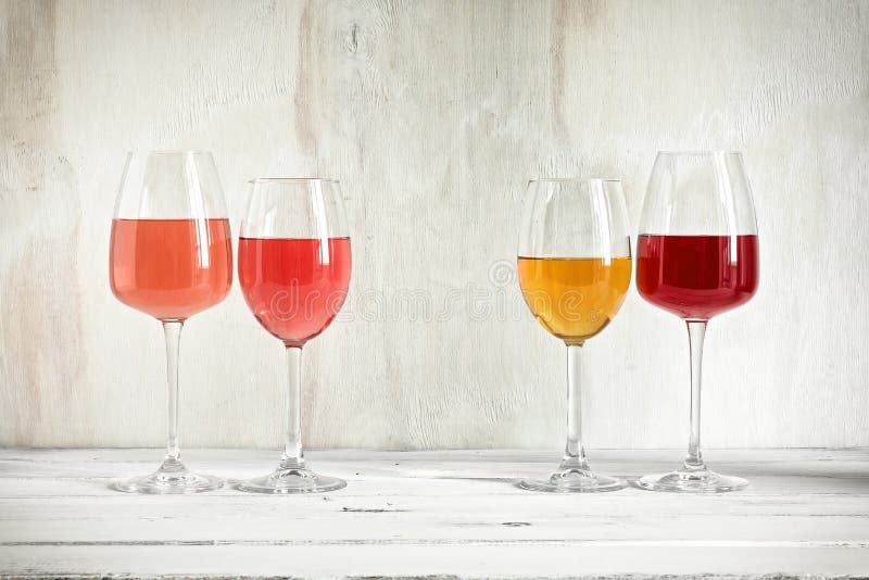 Assorted Different Wines in Glasses on a White Wooden Table. Wine ...