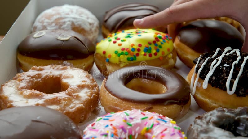 Assorted Donuts with Different Fillings and Icing. Dolly Video Stock ...