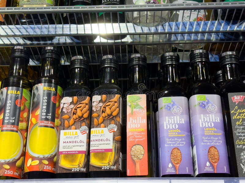 Assorted Edible Oil Bottles on Store Shelf with Natural Ingredients ...