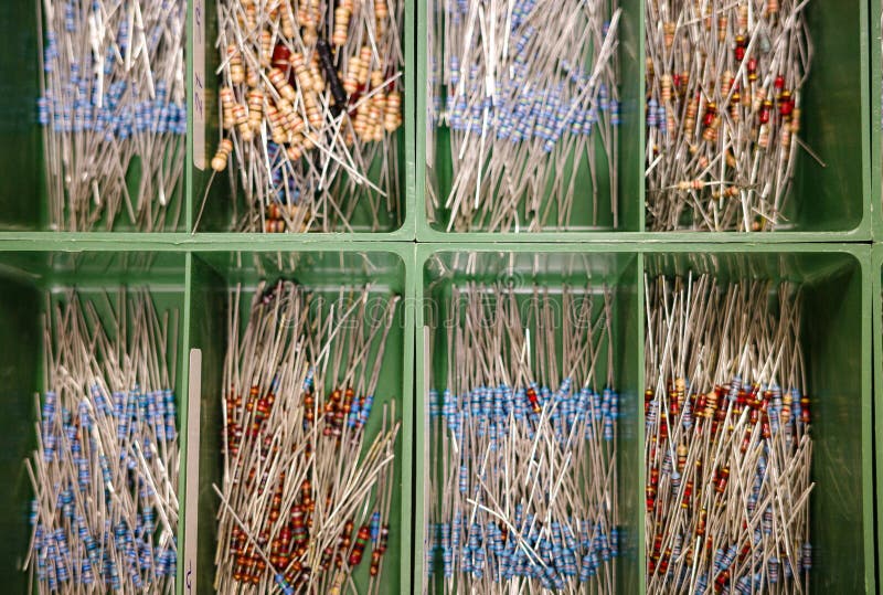 Assorted Electronic Resistors Organized in Green Storage Compartments ...