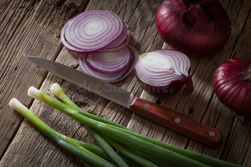 Assorted Farm Fresh Onions on a Wooden Table with Spring Onions Stock ...