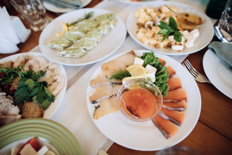 Assorted Fish on a Plate on a Holiday Table in a Restaurant. Different ...