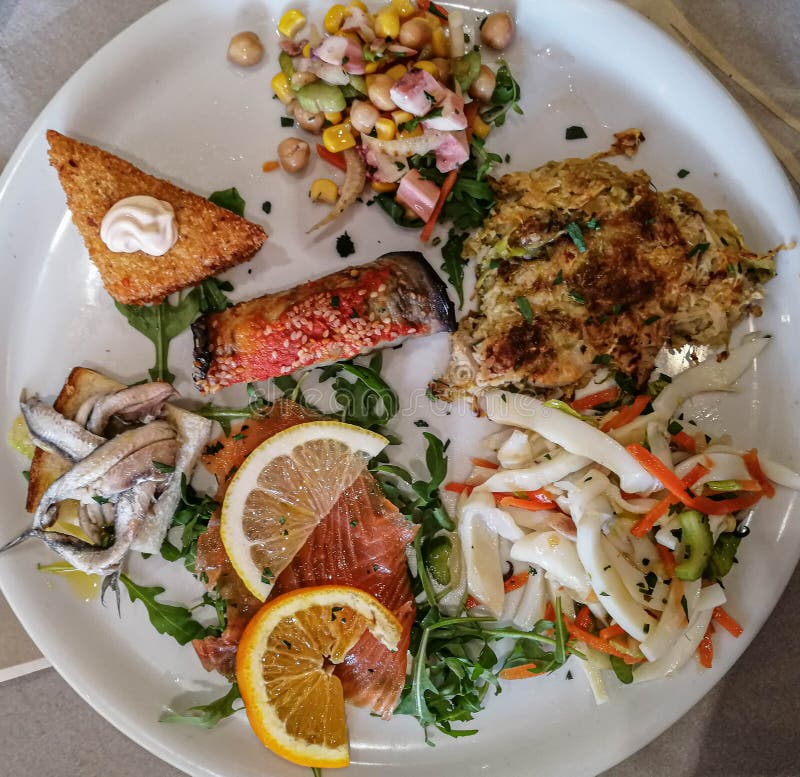 Assorted Fish and Seafood Served on a White Plate Stock Image - Image ...