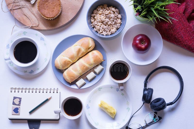 Assorted Food and Coffee with Notebook on the Table. Stock Photo ...