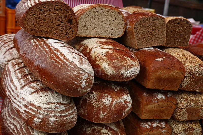 Assorted Fresh Bread Loaves on Retail Display Stock Photo - Image of ...