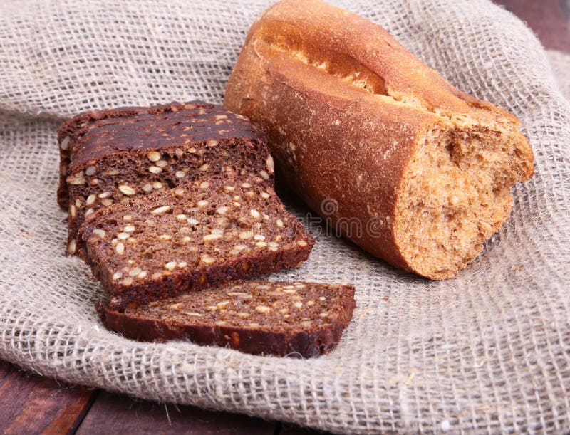 Assorted Fresh Breads, Slice and Knife Isolated on Old Wood Table ...