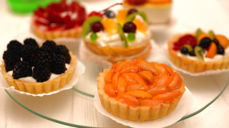 Assorted Fresh Fruit Pastries Spinning on Glass Stock Video - Video of ...