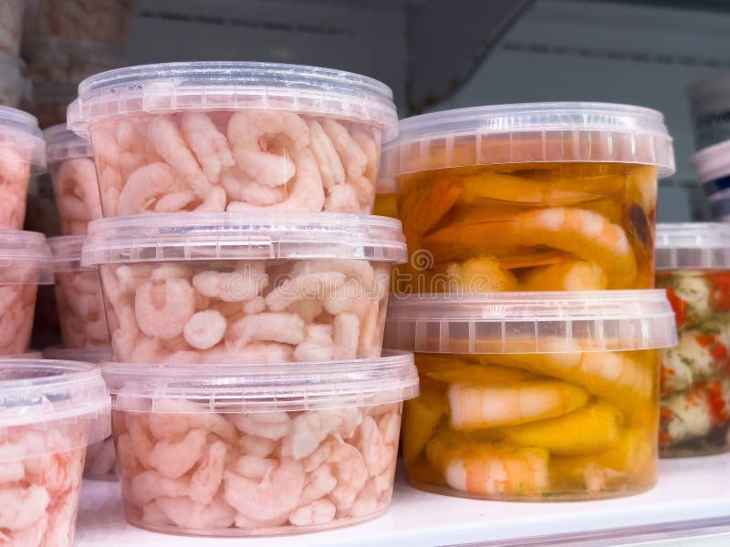 Assorted Frozen and Marinated Shrimp in Plastic Containers on ...