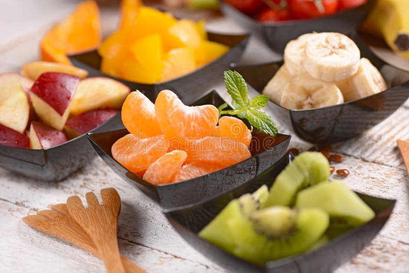 Assorted fruit in bowls stock photo. Image of mint, vegetarian - 73081612