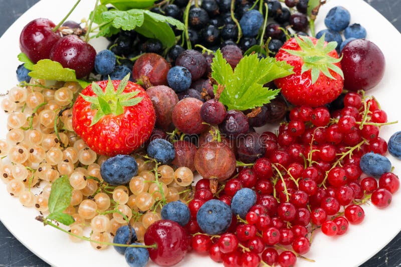Assorted Garden Berries on a Plate, Close-up Stock Image - Image of ...
