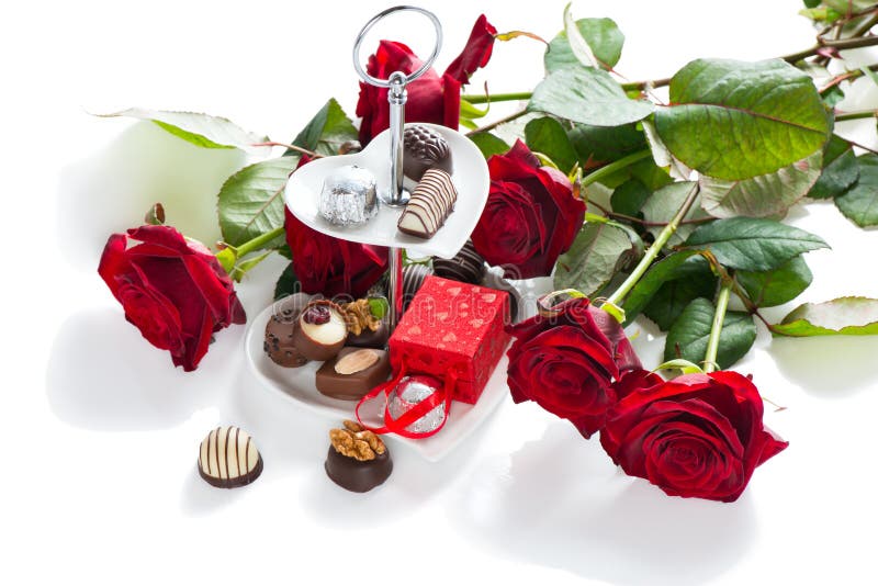Assorted Gourmet Chocolate and Bouquet Red Roses Stock Image - Image of ...