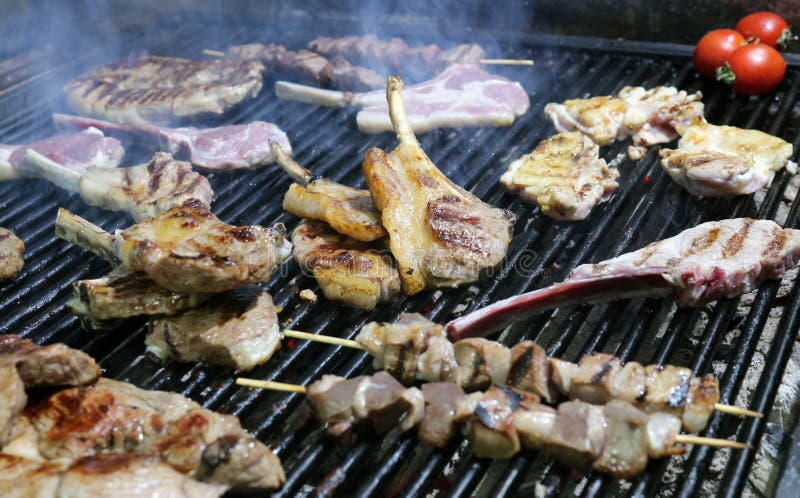 Assorted Grilled Meat with Vegetables on a Barbecue Stock Image - Image ...