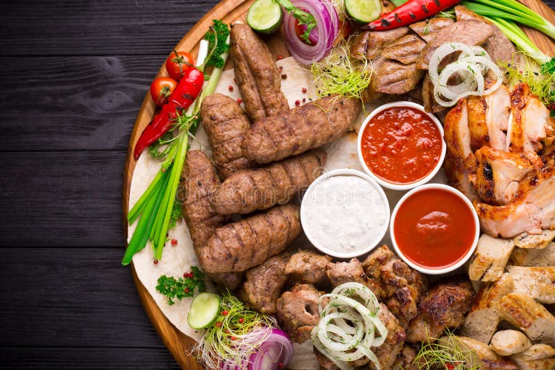 Assorted Grilled Meat and Vegetables on Rustic Table Stock Image ...