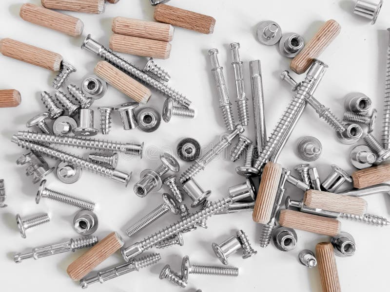 Assorted Hardware Pieces. Screws, Dowels, and Fasteners on White ...