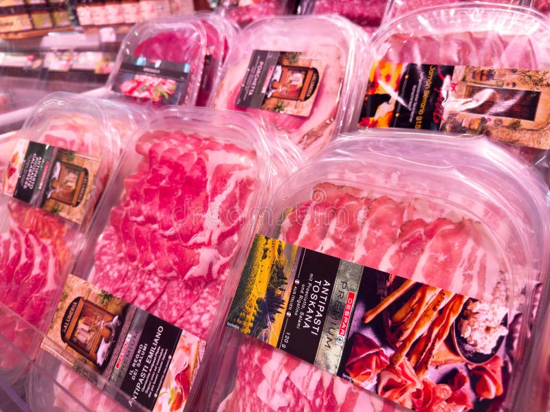 Assorted Italian Cured Meats in Packaging Displayed at Grocery Store ...
