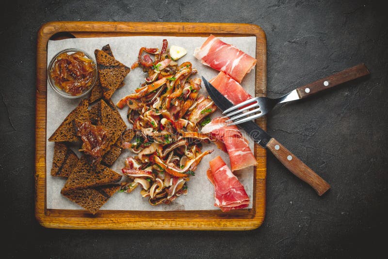 Assorted Jamon and Bacon on a Wooden Table Stock Photo - Image of jamon ...