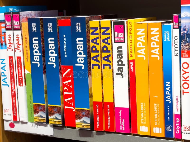 Assorted Japan Travel Guidebooks on a Shelf with Vibrant Covers ...