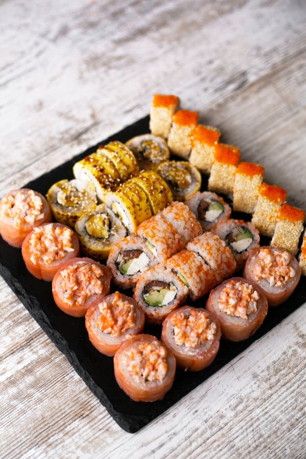 Assorted Japanese Sushi Rolls on Black Background Stock Photo - Image ...