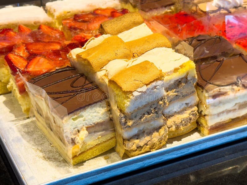 Assorted Layered Pastries: Creamy, Chocolate, and Strawberry Cake ...