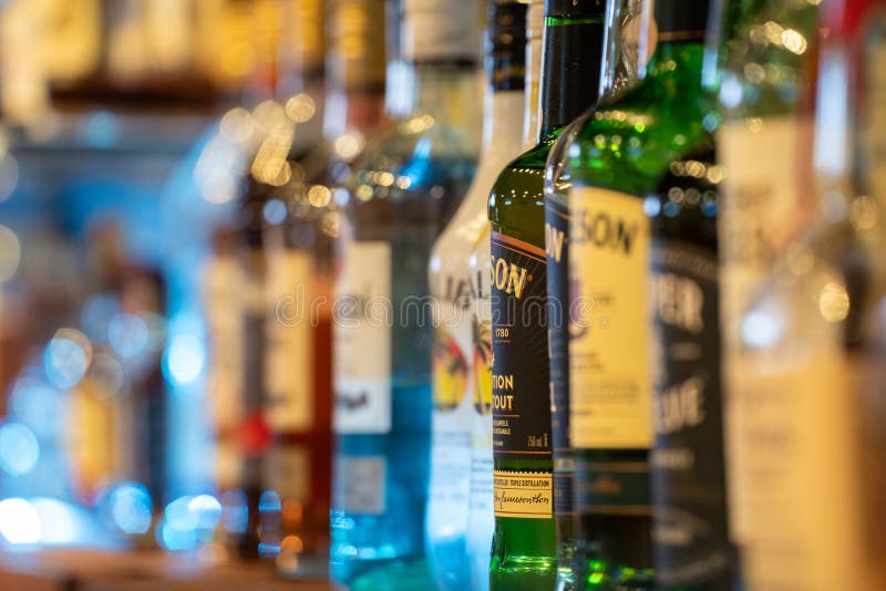 Assorted Liquor Bottles on a Bar Shelf. Editorial Stock Photo - Image ...