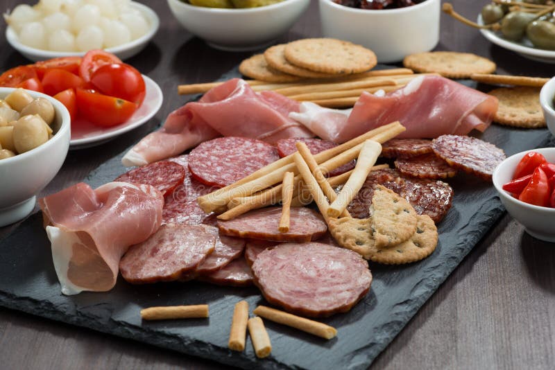 Assorted Meat Snacks, Sausages and Pickles on a Blackboard Stock Image ...