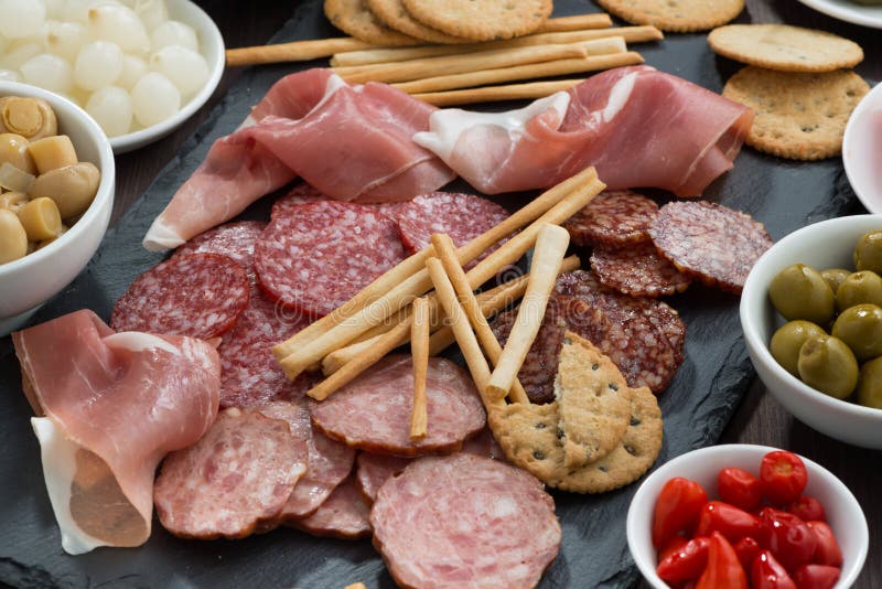 Assorted Meat Snacks, Sausages and Pickles on a Blackboard Stock Image ...