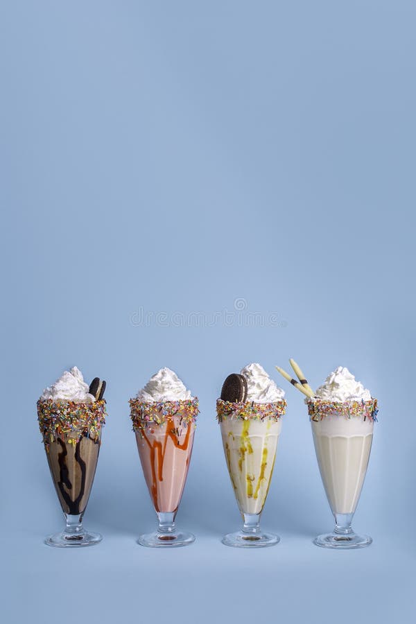 Assorted Milkshakes on a Blue Background. Photos for the Menu Stock ...