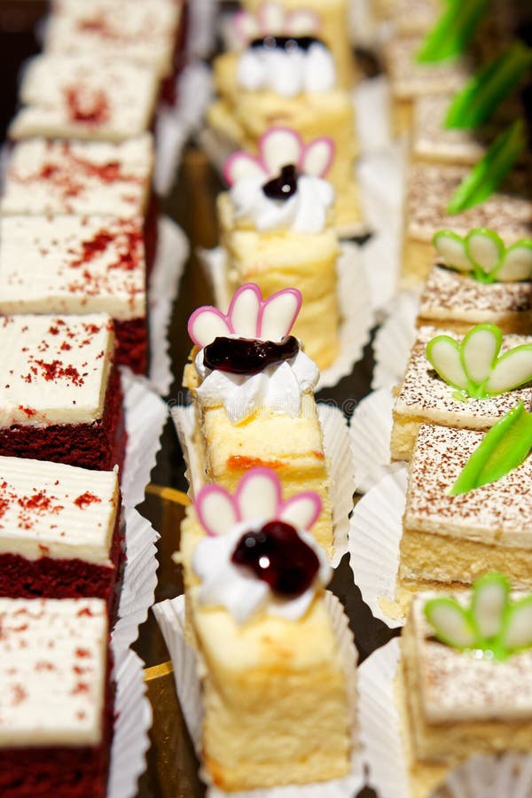 Assorted Mini Cakes with Decorative Toppings. Stock Image - Image of ...