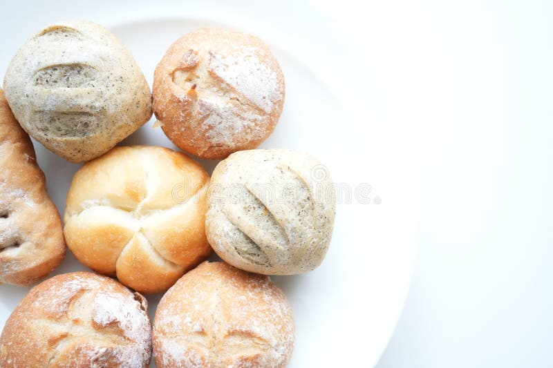 Assorted Miniature Bread Rolls on a White Plate Stock Image - Image of ...