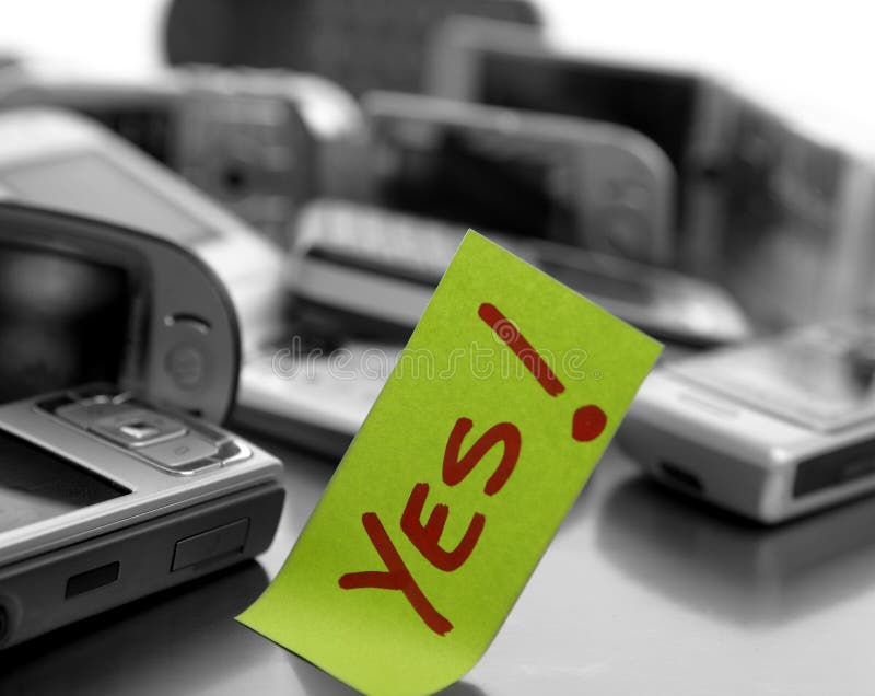 Assorted Mobile Phones and Written Word: YES Stock Image - Image of ...