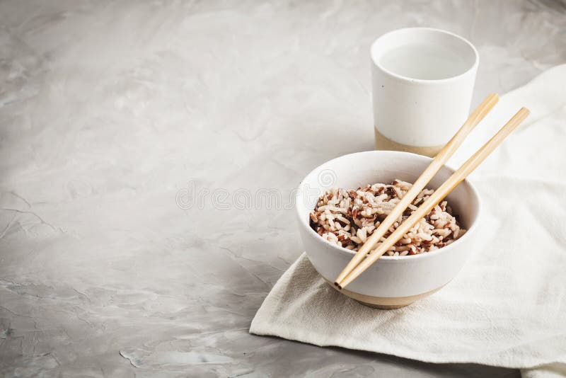 Assorted Multi-colored Wild Rice in Ceramic Bowl and Chopsticks Stock ...