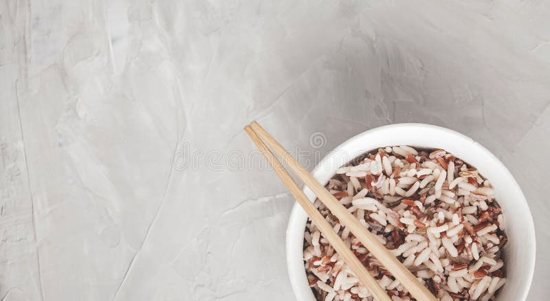 Assorted Multi-colored Wild Rice in Ceramic Bowl and Chopsticks Stock ...
