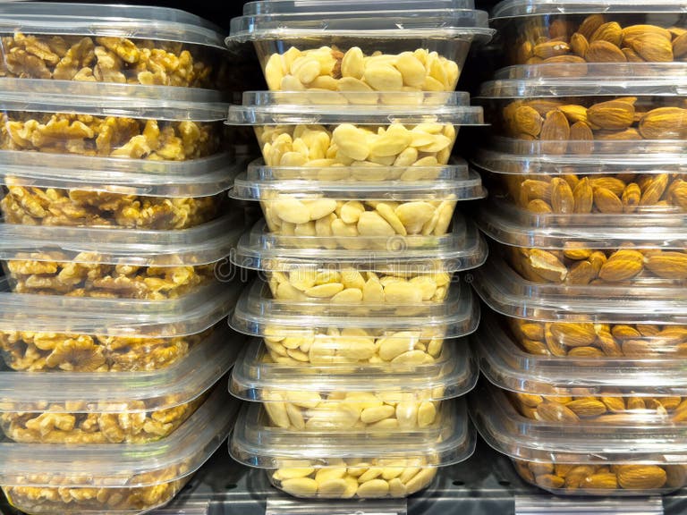 Assorted Nut Selection in Plastic Containers: Walnuts, Almonds ...