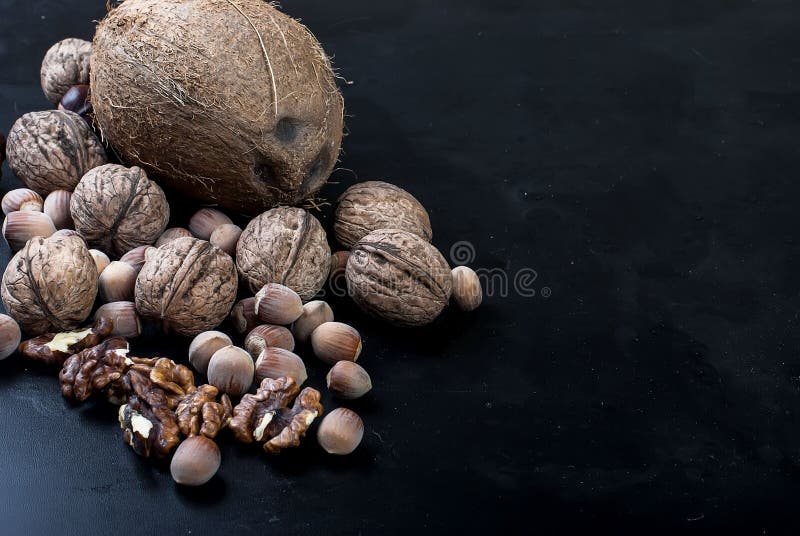 Assorted Nuts on a Black Background Stock Photo - Image of group, black ...