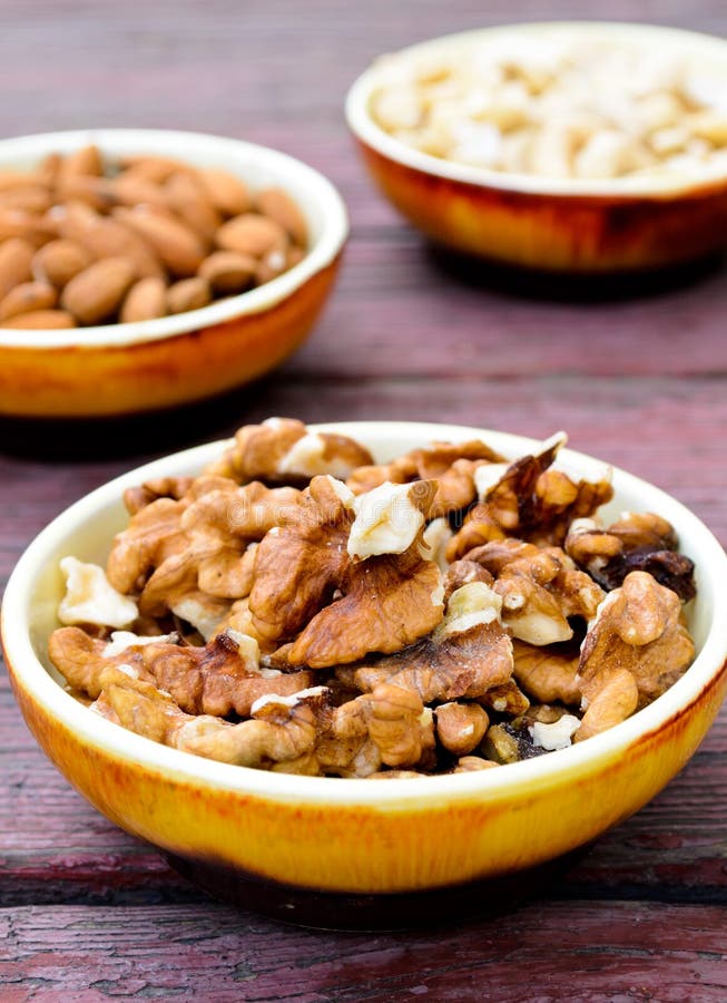 Assorted Nuts in Dishes on Wooden Table Stock Photo - Image of grunge ...